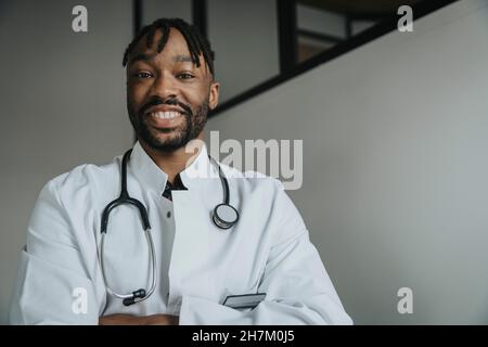 Young bearded African man doctor against white background Stock Photo ...
