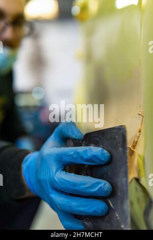 A vertical shot of a mechanic fixing his car outdoors Stock Photo - Alamy