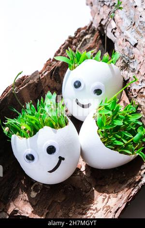 Easter egg shell with greens on gray background. Holiday composition ...