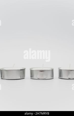pure wax scented tea lights on a white background with space for text ...
