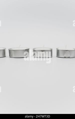 pure wax scented tea lights on a white background with space for text ...