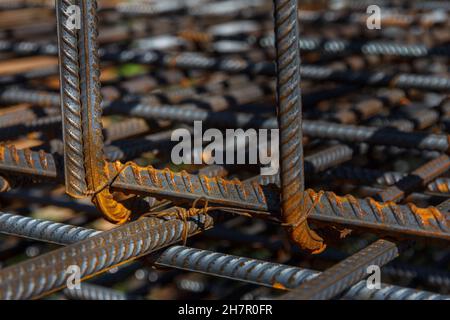 Stacked steel rods for concreting. Preparation of the base for the ...