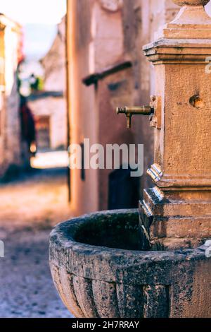 Medieval drinking fountain Stock Photo - Alamy