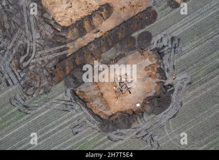 Goosefeld, Germany. 24th Nov, 2021. Archaeologists uncover a large ...