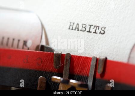 The word habits written with a typewriter Stock Photo - Alamy