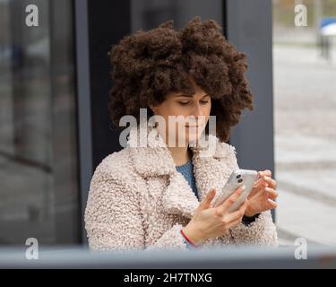 portrait young woman with afro type hair lifestyle Stock Photo - Alamy