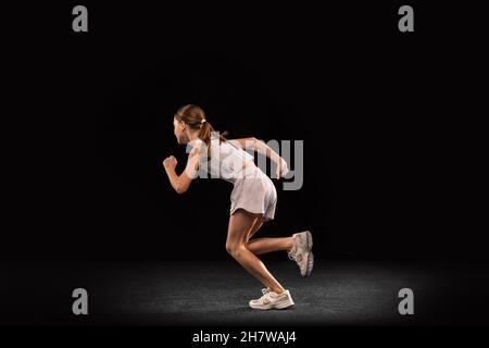 girl athlete runner running side view black silhouette Stock Photo - Alamy