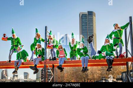 EDITORIAL USE ONLY Eleven 'elves’ sit side-by-side on a 4-metre tall ...