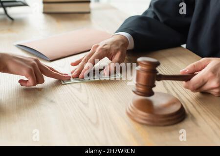 Judge Taking Bribe From Client Stock Photo - Alamy