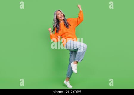 Full size photo of astonished lady dance wear blue top jeans sneakers ...