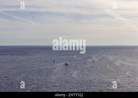 Red and green navigational buoys, starboard and port side buoys on open ...