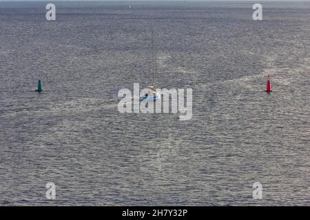 Red and green navigational buoys, starboard and port side buoys on open ...