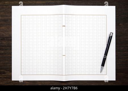Japanese manuscript paper with ballpoint pen. Genko yoshi on wooden ...