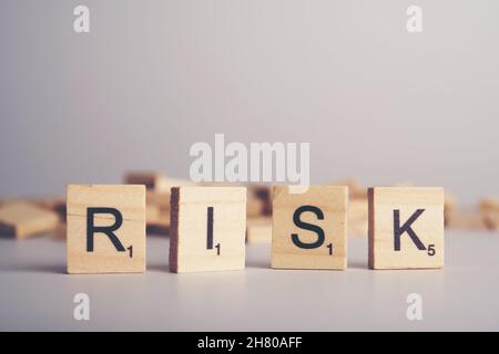 RISK wooden tile font concept Stock Photo - Alamy