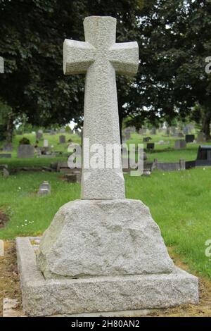 A Stone Cemetery Cross on a Plinth in a Graveyard Stock Photo - Alamy
