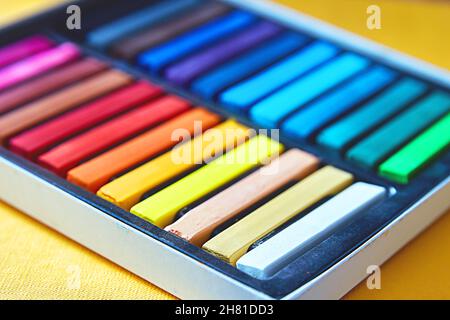 Multicolored pastel crayons art store in wooden cells. Artspace ...
