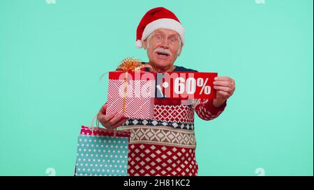 Grandfather in Christmas sweater showing gift box and 80 Percent ...