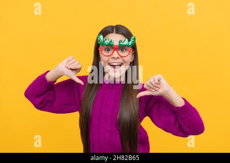 amazed kid in party glasses on yellow background, christmas Stock Photo ...