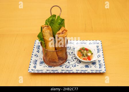 The spring roll, chun kun, similar to lumpiá, is a roll made of a paste ...