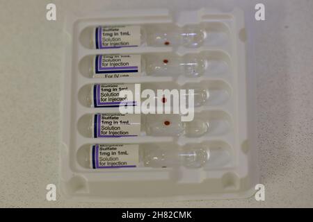 a glass ampoule of morphine sulphate solution containing 1mg in 1ml ...