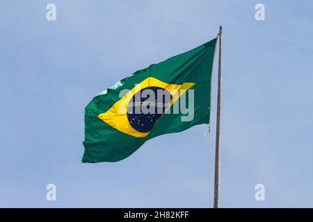 brazil flag outdoors with a beautiful blue sky in Rio de Janeiro Stock ...