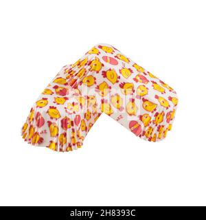 White paper baking forms for cakes with daises pattern isolated over ...