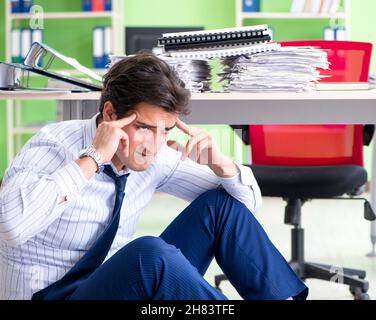 Frustrated businessman stressed from excessive work Stock Photo - Alamy