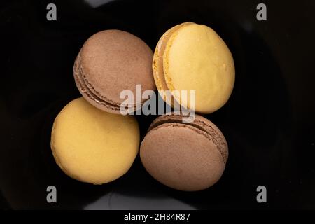 Several sweet macaroons on a ceramic plate, close-up, top view Stock ...