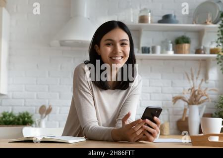 Beautiful Asian woman sit in front of a mirror. face of a healthy woman ...