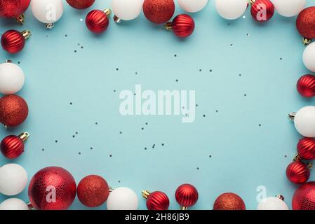 Christmas balls with sequins on red background Stock Photo - Alamy