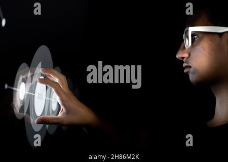 Man touching a smart home concept on a touch screen with his finger ...