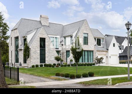 Exterior of a house with white board and batten siding Stock Photo - Alamy