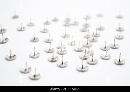 Heap of Metal Pushpin or Drawing Pin isolated on white Stock Photo - Alamy