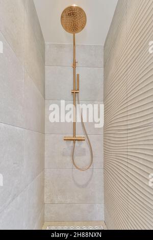 Modern shower cubicle with elegant dark tiles Stock Photo - Alamy