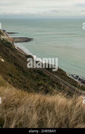 Winter sun light glows on the English channel seen from the cliff tops ...
