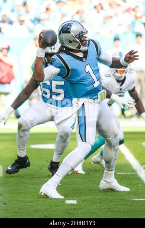 Carolina Panthers quarterback Cam Newton (1) turns to hand the ball off ...