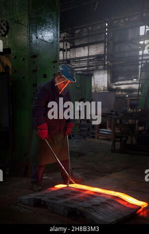 Fully forged and clipped flight bar (mining component) is lined up to ...