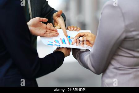 Close-up of graphs and charts analyzed by business people Stock Photo ...
