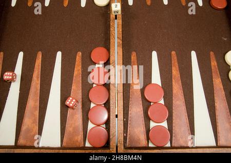 Traditional backgammon game. Board with backgammon game pieces on black ...