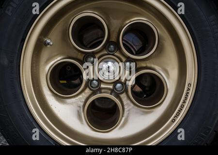 Close up detail of a gold Campagnolo Bravo alloy wheel on a red ...