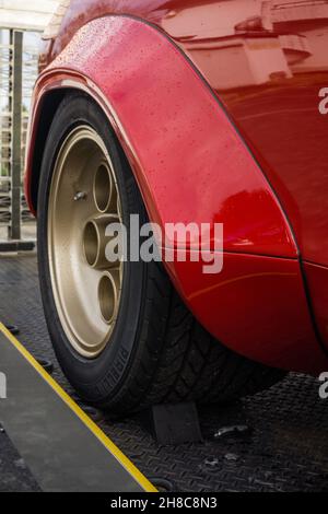 Close up detail of a gold Campagnolo Bravo alloy wheel on a red ...