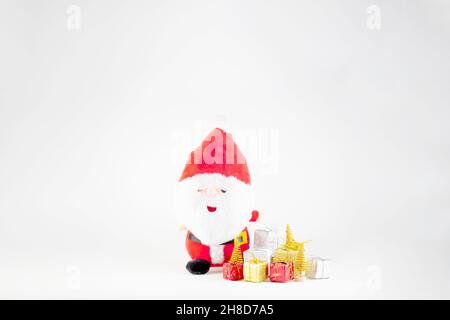 Generic soft toy of Santa Clause with Christmas tree and gifts on white ...