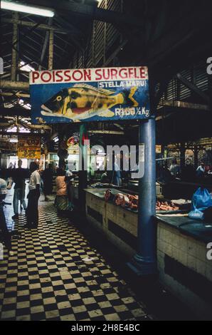 A fishmonger at the historic market hall of Port Louis Stock Photo - Alamy