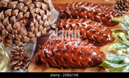 Sweet chocolate bread pinecone cakes on a wooden board Stock Photo - Alamy