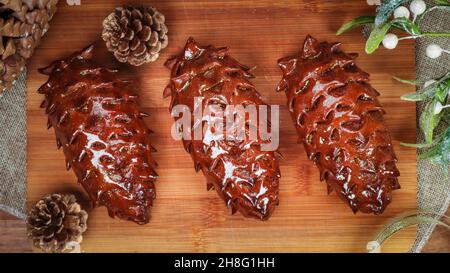 Sweet chocolate bread pinecone cakes on a wooden board Stock Photo - Alamy