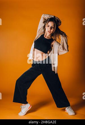 Dance moves performed by an acrobatic flexible female dancer Stock ...