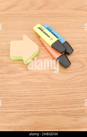 Blank paper sheets with felt-tip pens, pencils, wooden mannequin ...