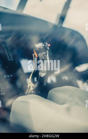 Cockpit of big airplane - seat and instrument panel with controls ...