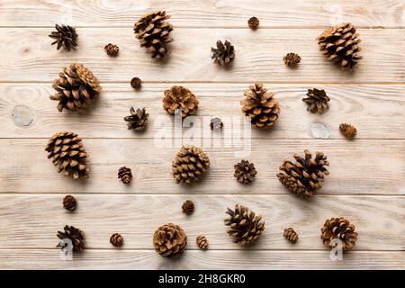 pine cones on colored table. natural holiday background with pinecones ...