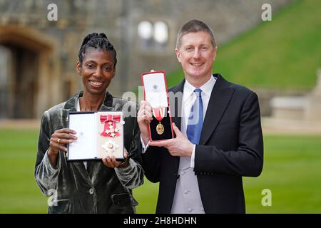 Dame Sharon White and her husband Sir Robert Chote with the awards they ...